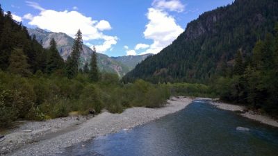 View of Baker River from suspension bridge along Baker Lake Trail near ...